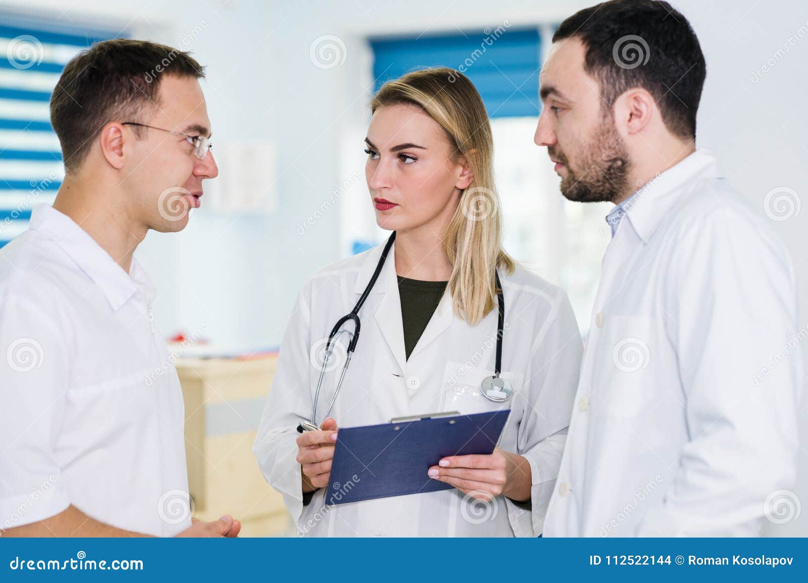 Medical Team Standing and Talking at the Hospital Stock Photo - Image ...