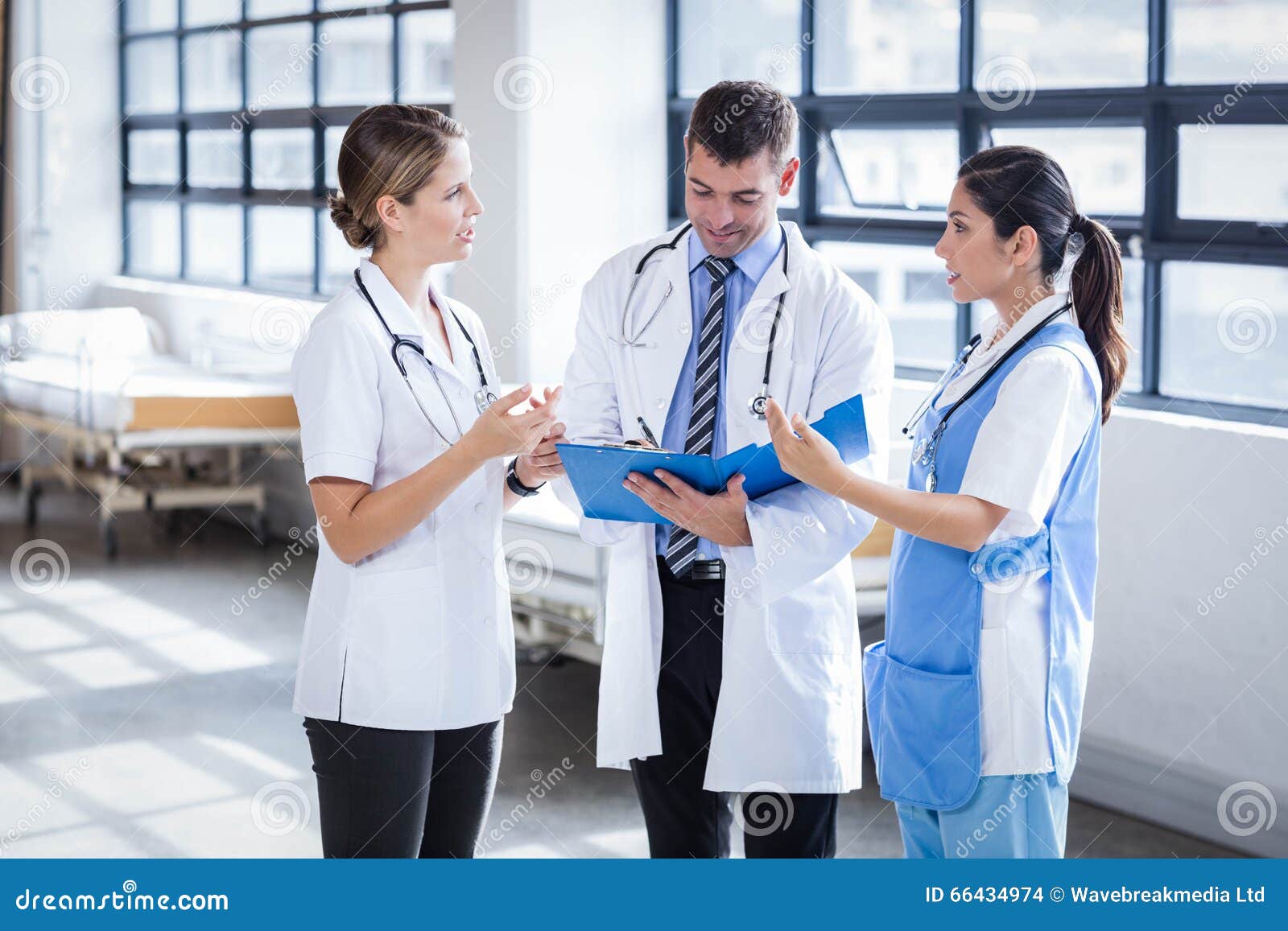 Medical Team Standing and Talking Stock Photo - Image of male, medical ...