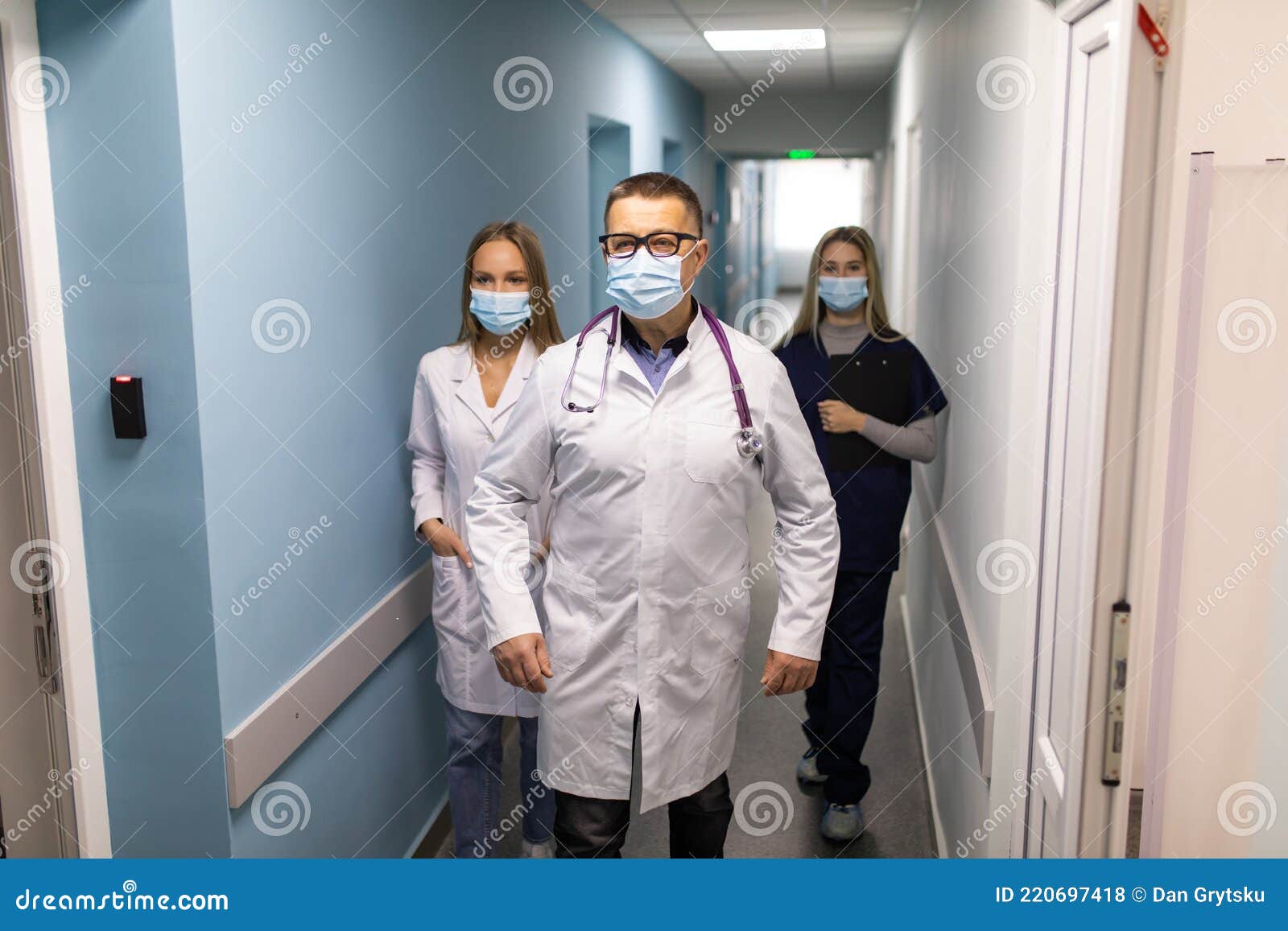 Medical Team Walking Down Hallway at the Hospital Stock Photo - Image ...