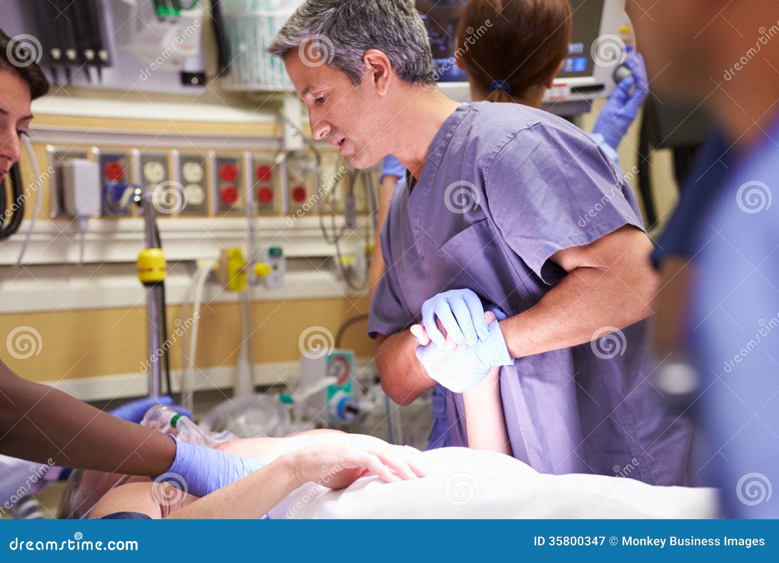 Medical Team Working on Patient in Emergency Room Stock Image - Image ...