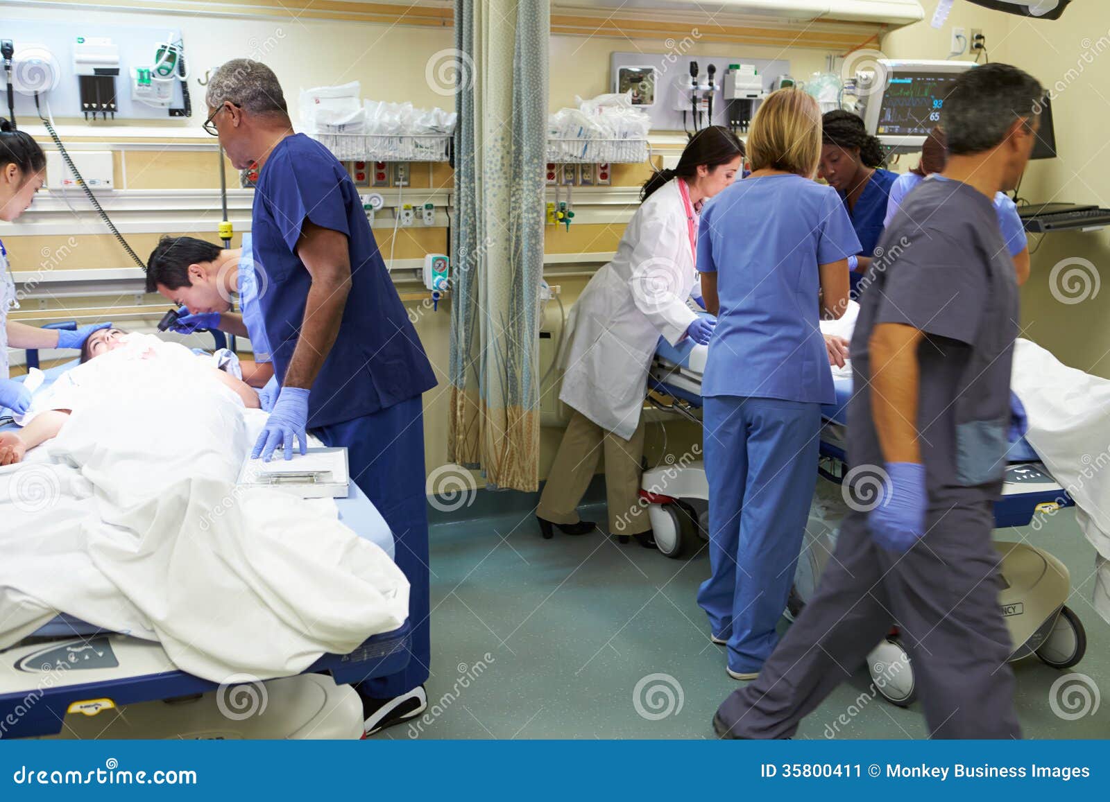 Medical Team Working On Patient In Emergency Room Stock Image Image
