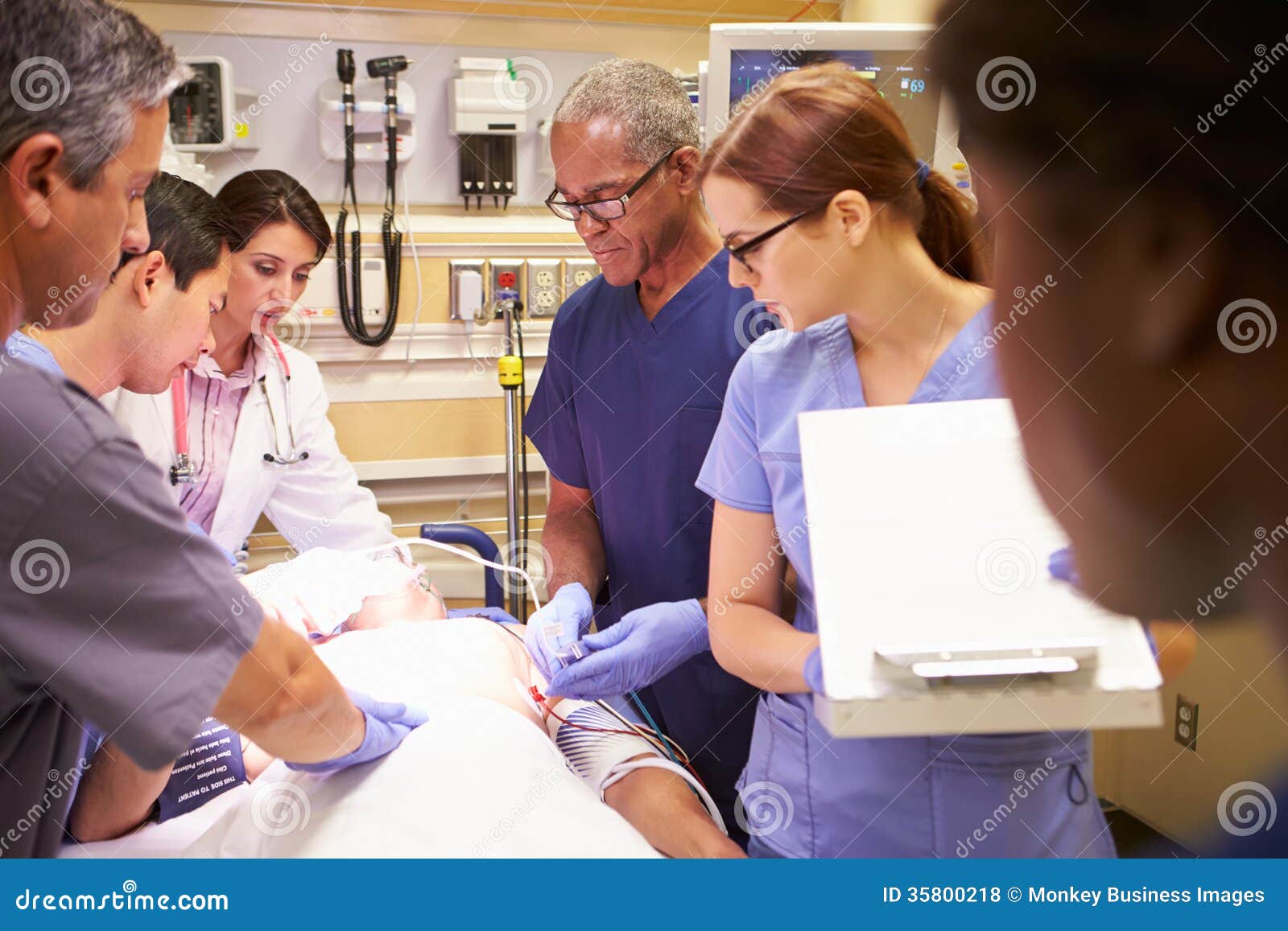 Medical Team Working on Patient in Emergency Room Stock Photo - Image ...