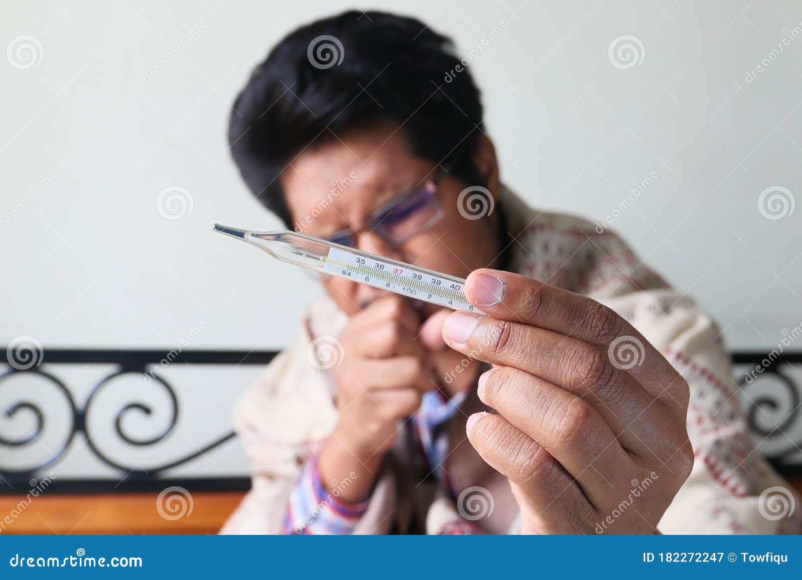 Medical Thermometer for Measuring Body Temperature in the Hand. Stock ...