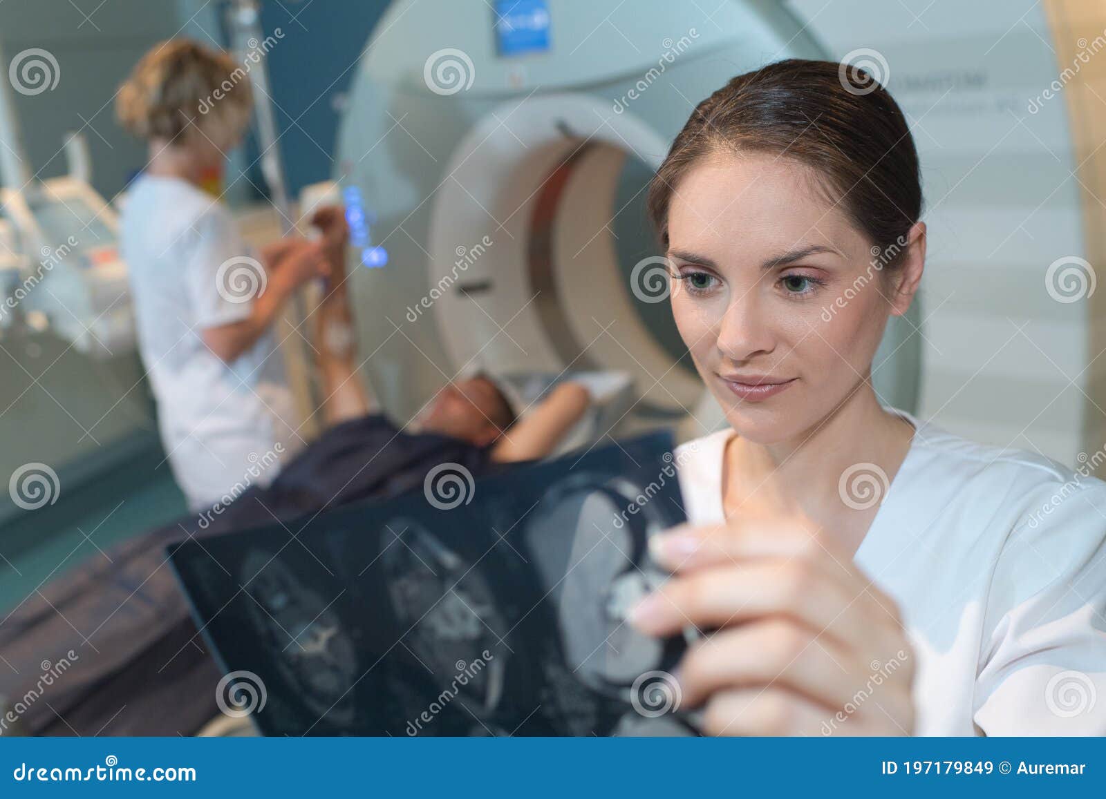 Medical Worker Examining Mri Scan Results Stock Image - Image of film ...