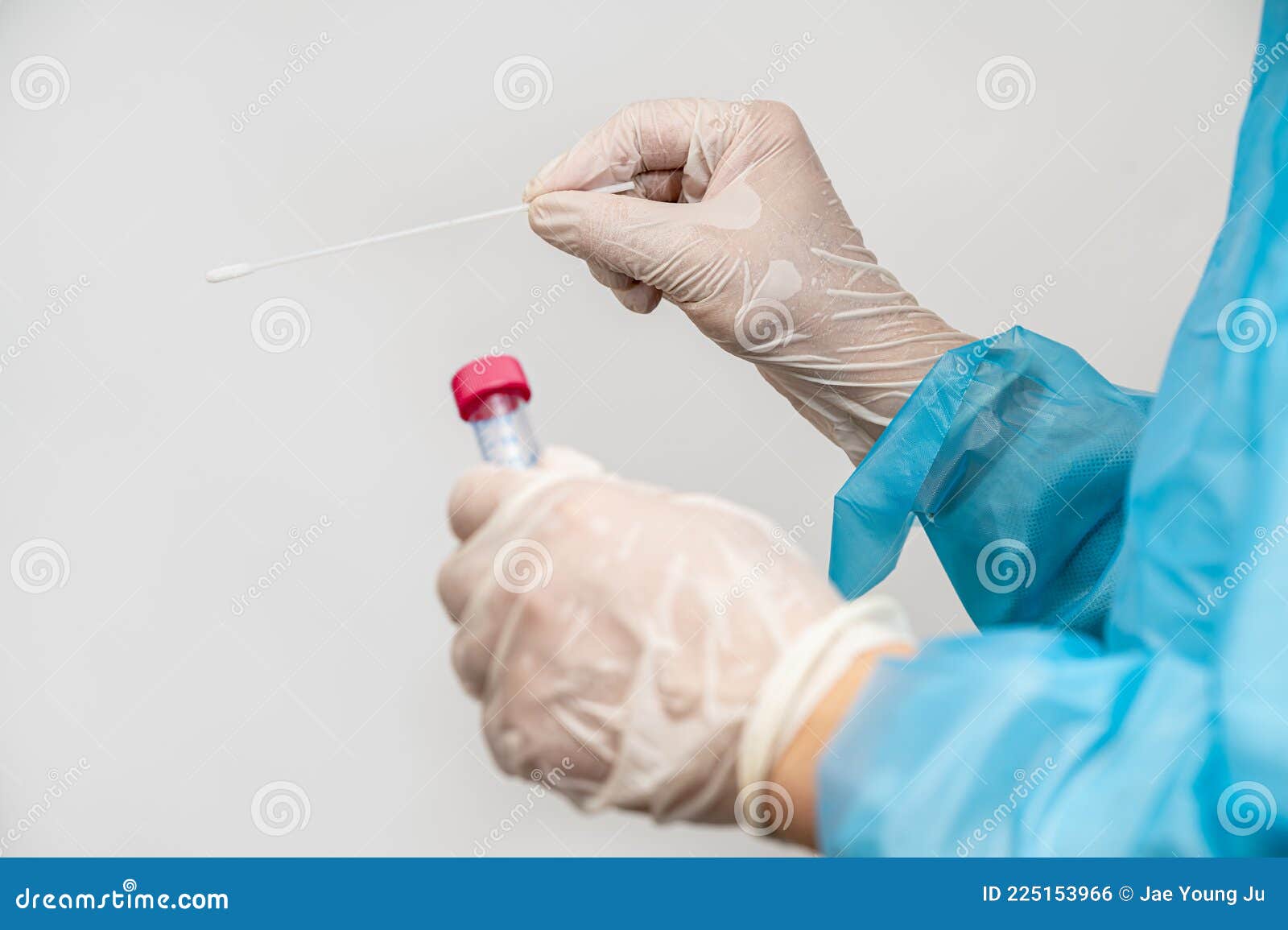 A Medical Worker Holding a Swab Sample Collection Kit Stock Photo ...