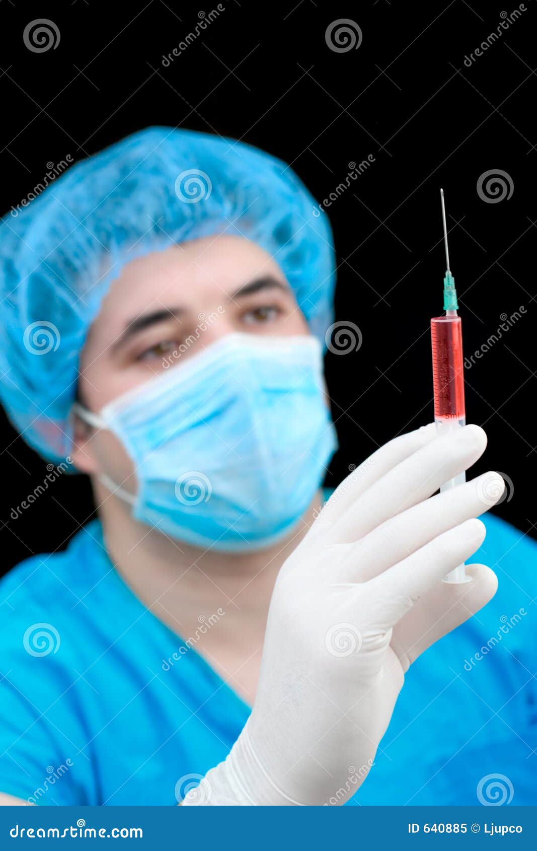 Medical Worker Holding a Syringe Stock Image - Image of hood ...