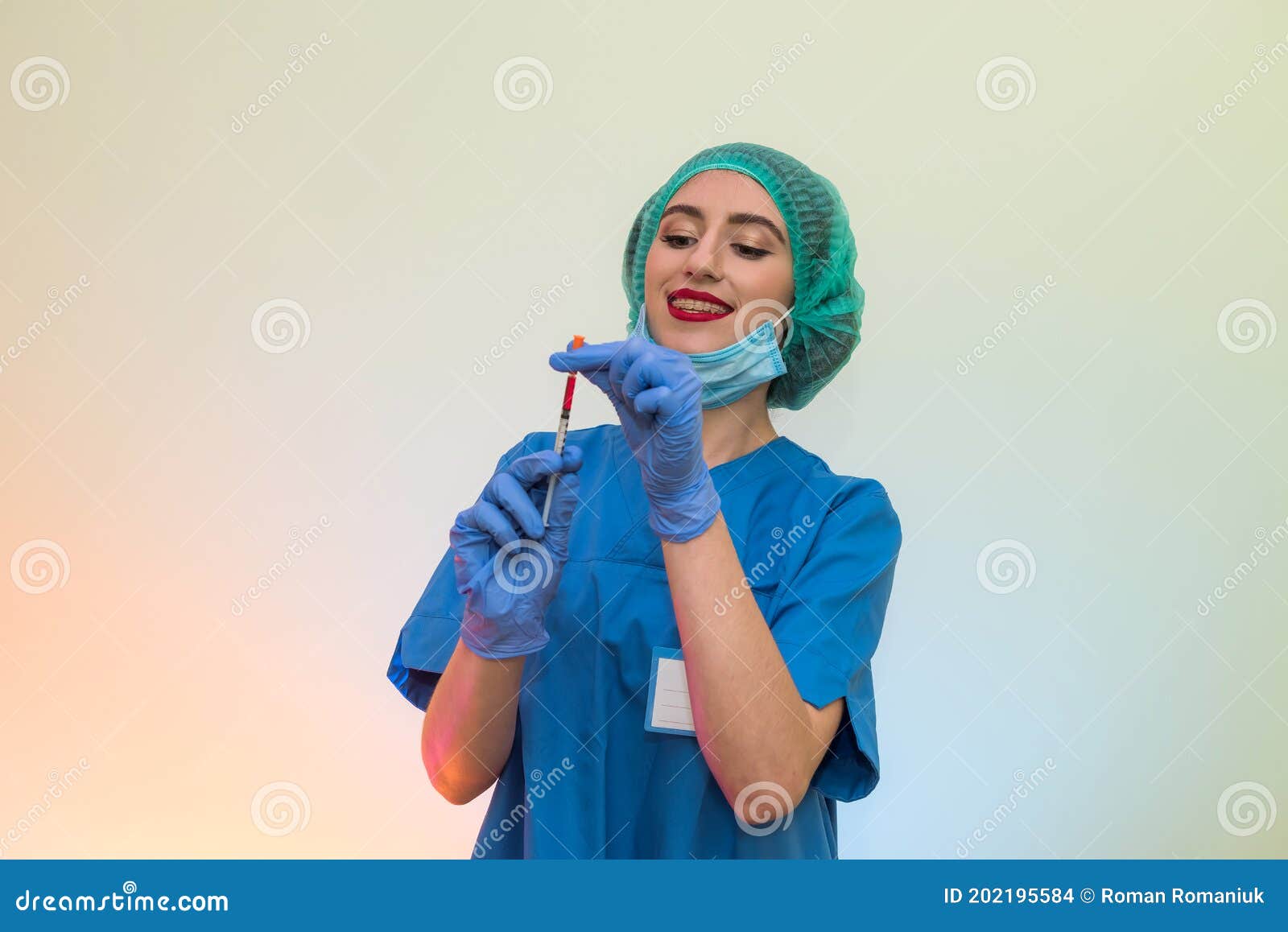Medical Worker Holding Syringe and Wearing Blue Uniform. Ready for ...