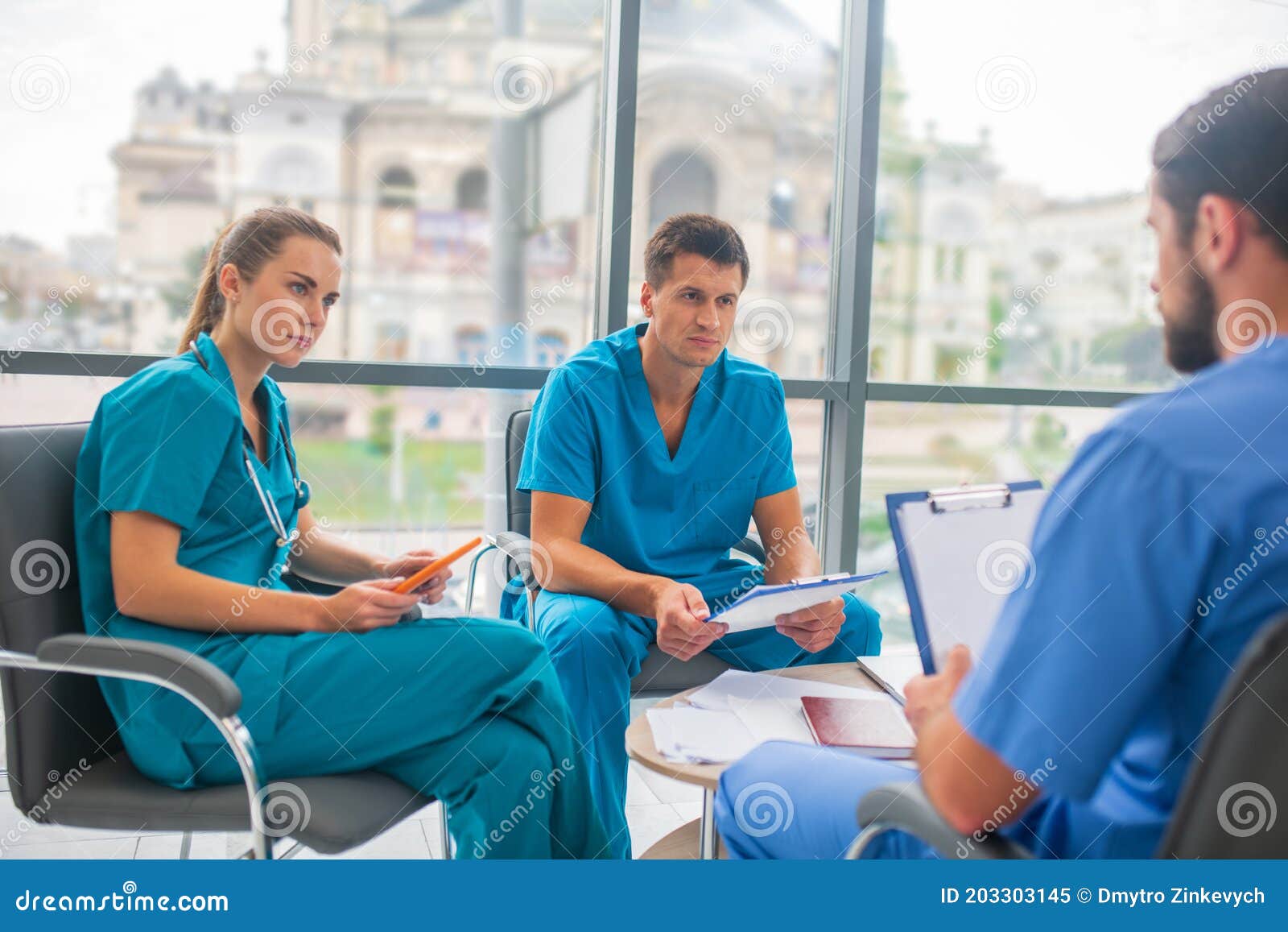 Medical Workers Having a Brainstorming about Way of Medical Treatment ...