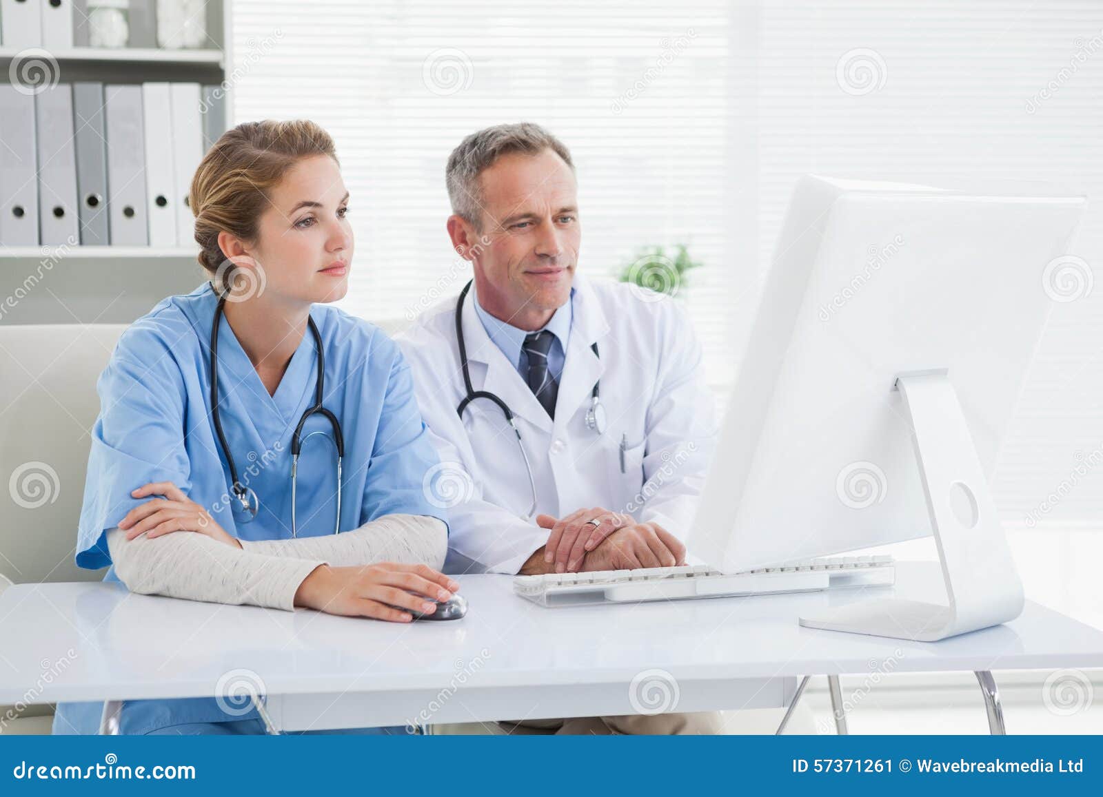 Medical Workers Looking at a Computer Stock Image - Image of medical ...