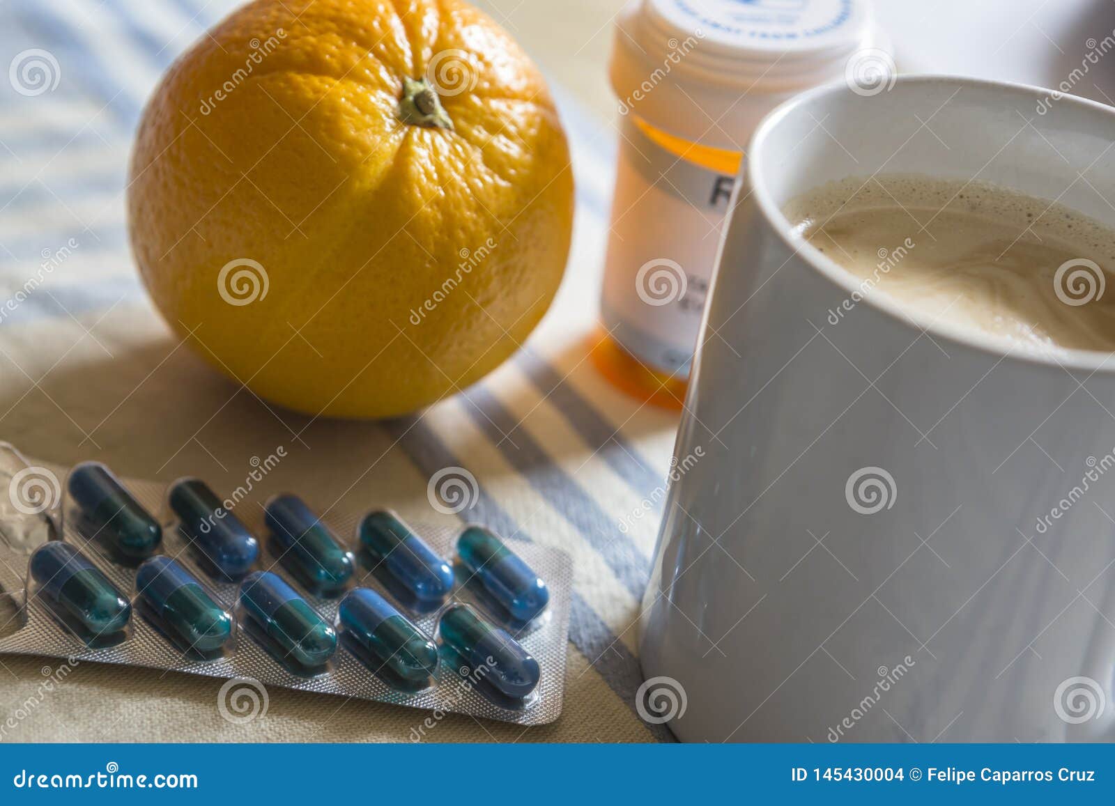 Medication during Breakfast, Capsules Next To a Orange Stock Photo ...