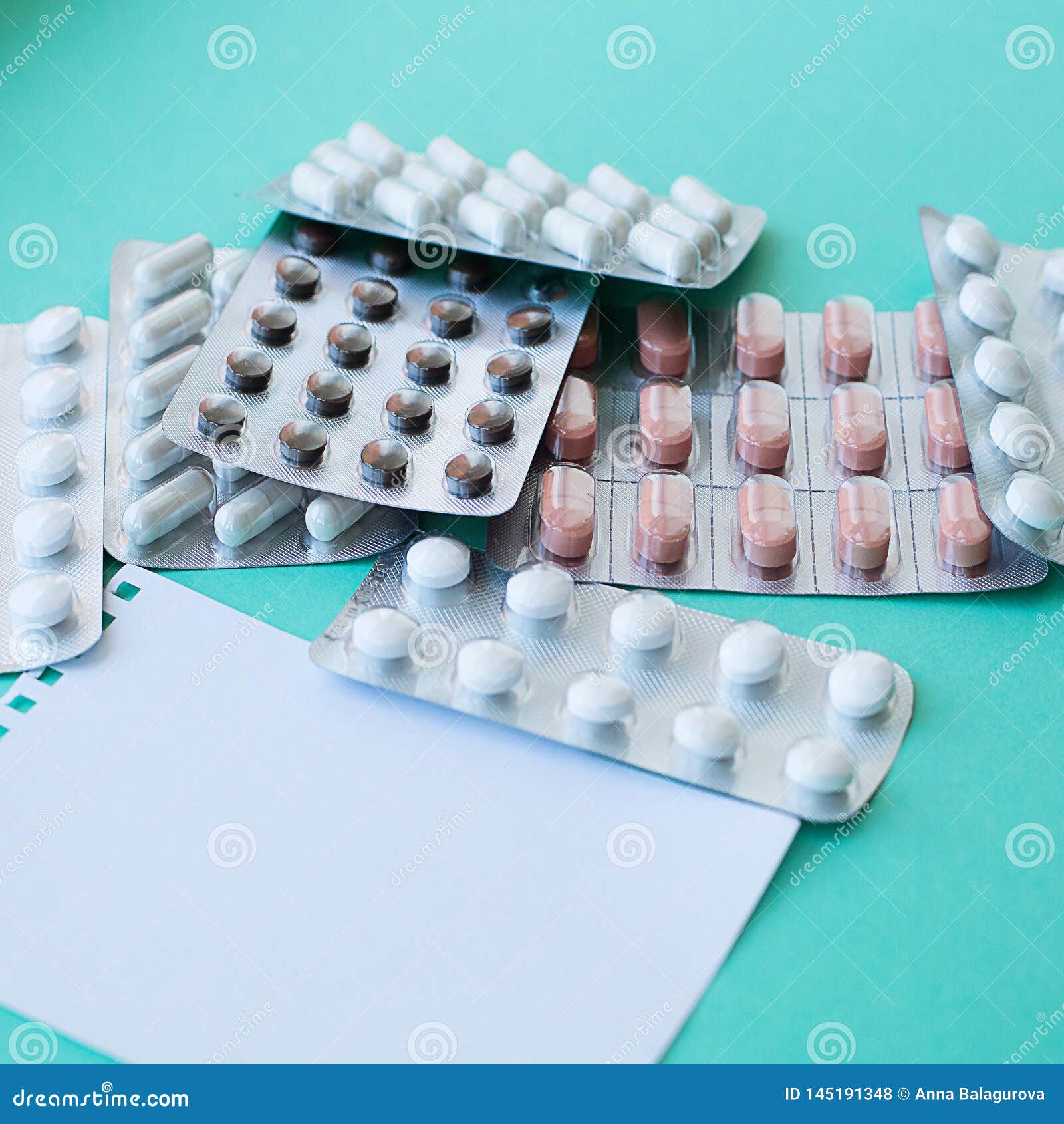 Pills in Packs and Empty Prescription on Green Background Stock Photo ...