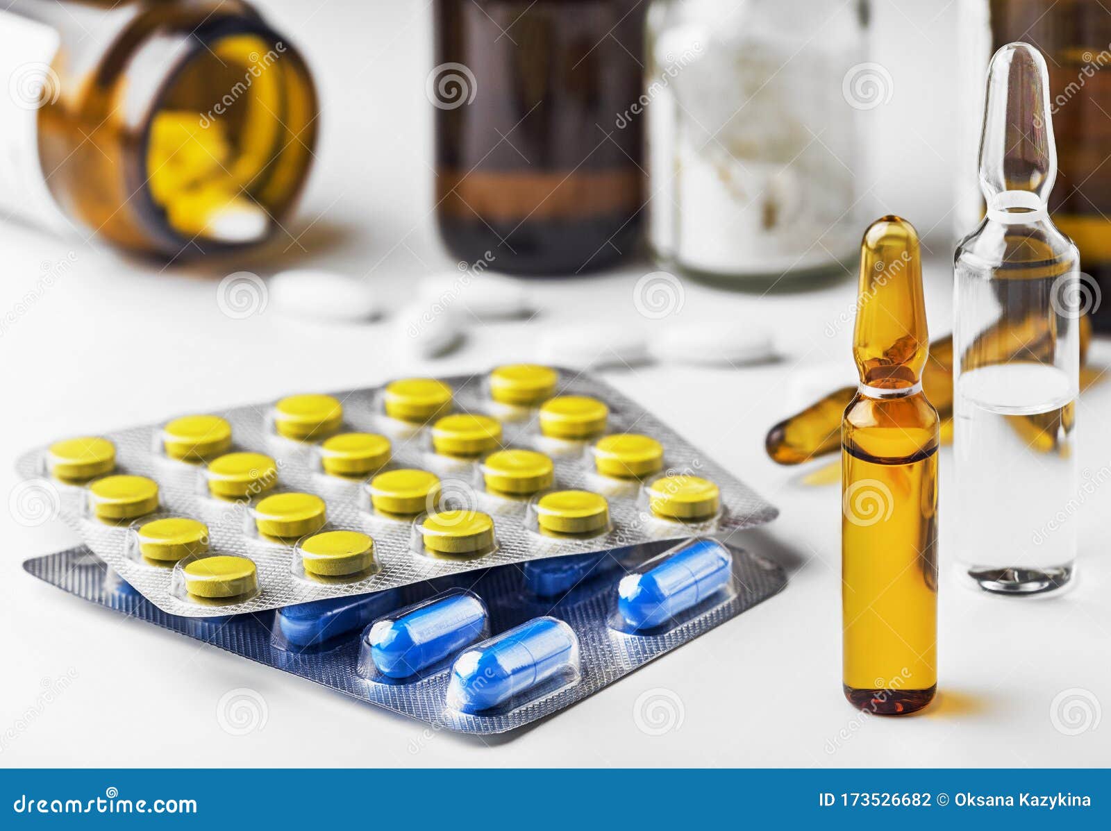 Ampoules For Injection And Many Capsules On A Light Blue Background ...