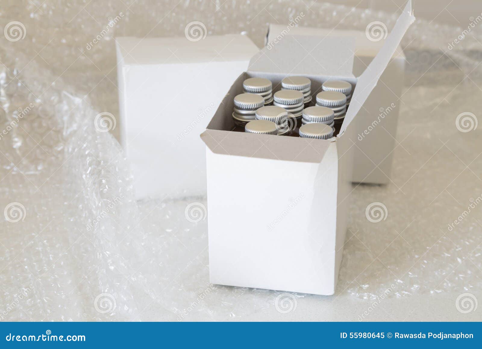Medicine Bottles in White Paper Box and Air Bubble Stock Image - Image ...