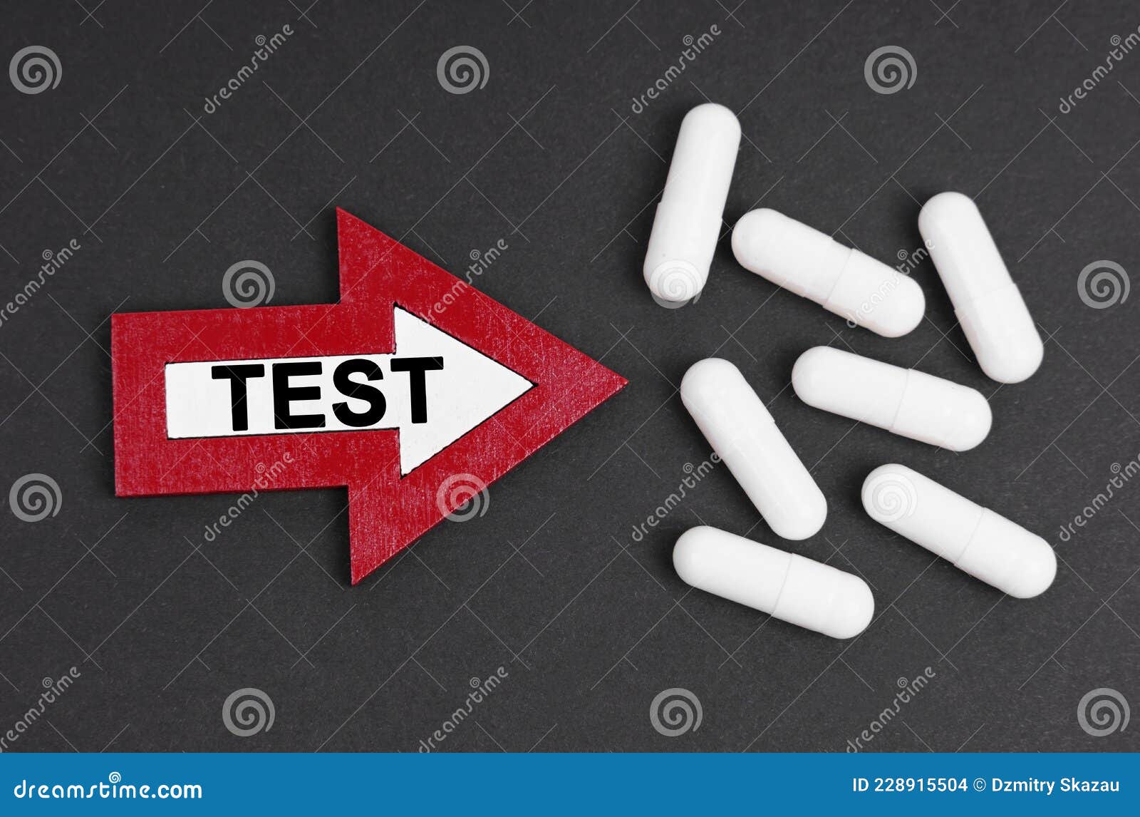 Tablets are on a Black Background. they are Indicated by an Arrow on ...