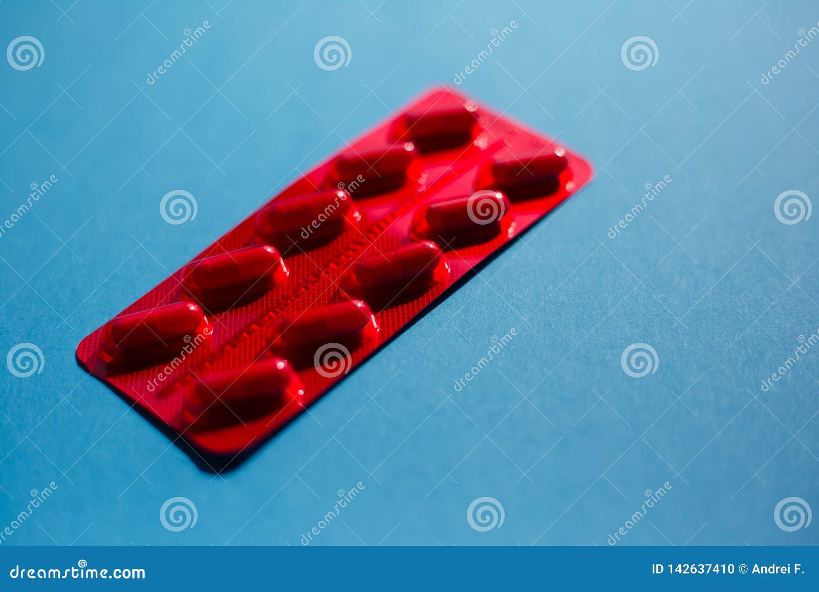 Medicine Pills Capsules, Red Pack Over Blue. Stock Photo - Image of ...