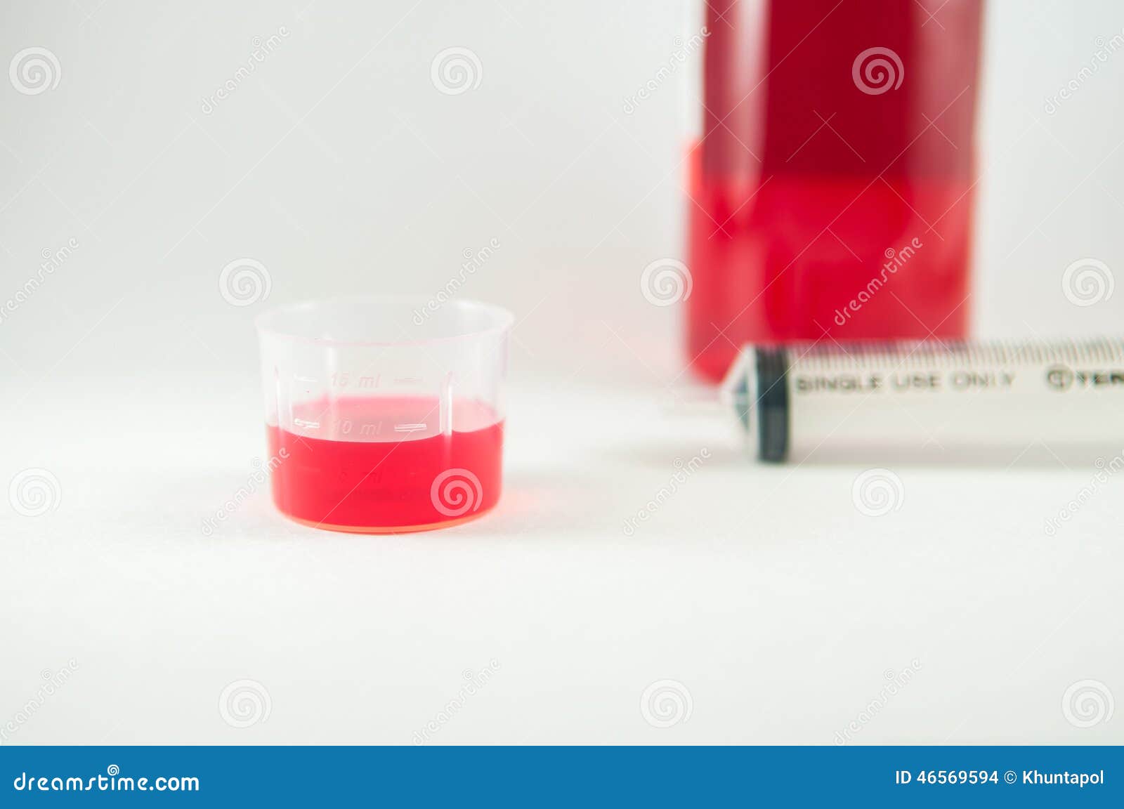 Medicine Syrup Plastic Measuring Cup and Medicine Stock Photo - Image ...