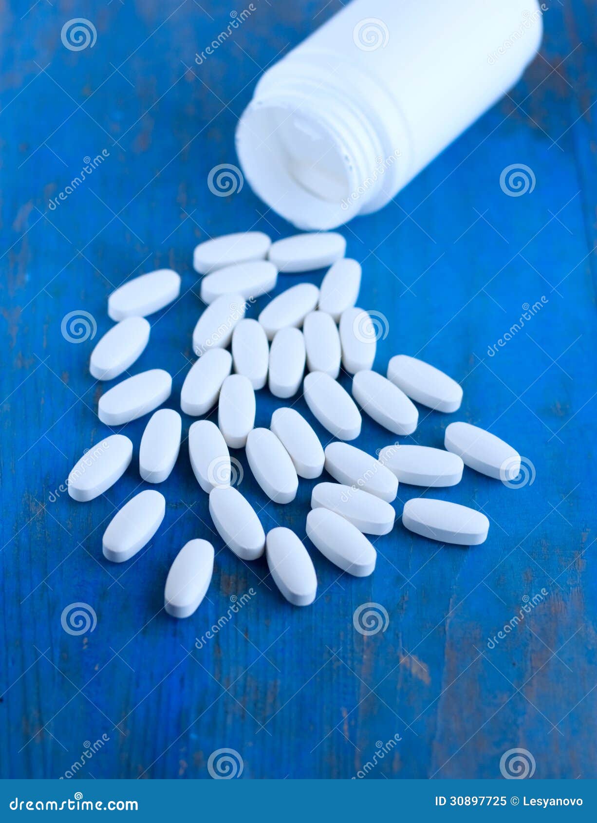 Medicine Tablet White Spill on the Blue Stock Image - Image of plank ...