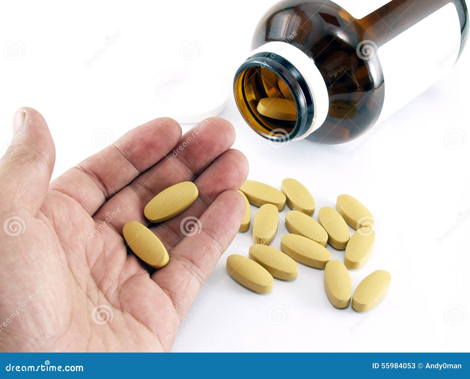 Two Medicine Pills on Men Hand with Many Tablets Scattered Out of ...