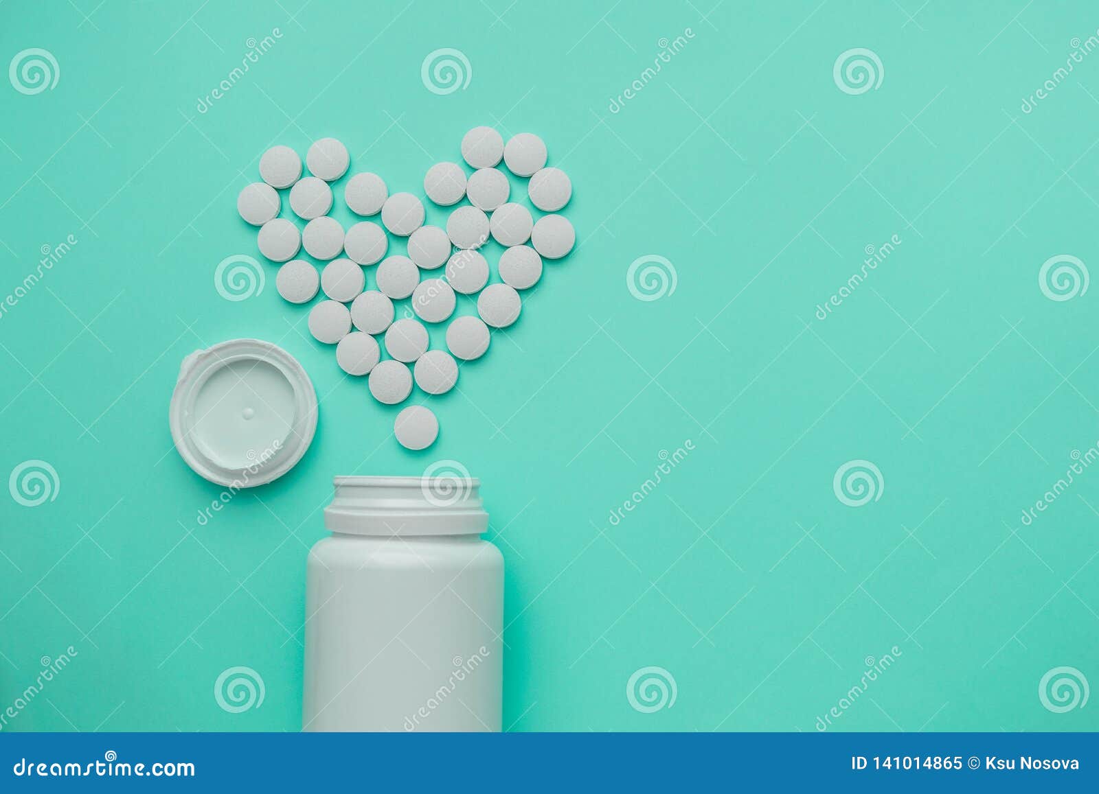 Medicines White, Round Heart Shaped Pills on Turquoise Background ...