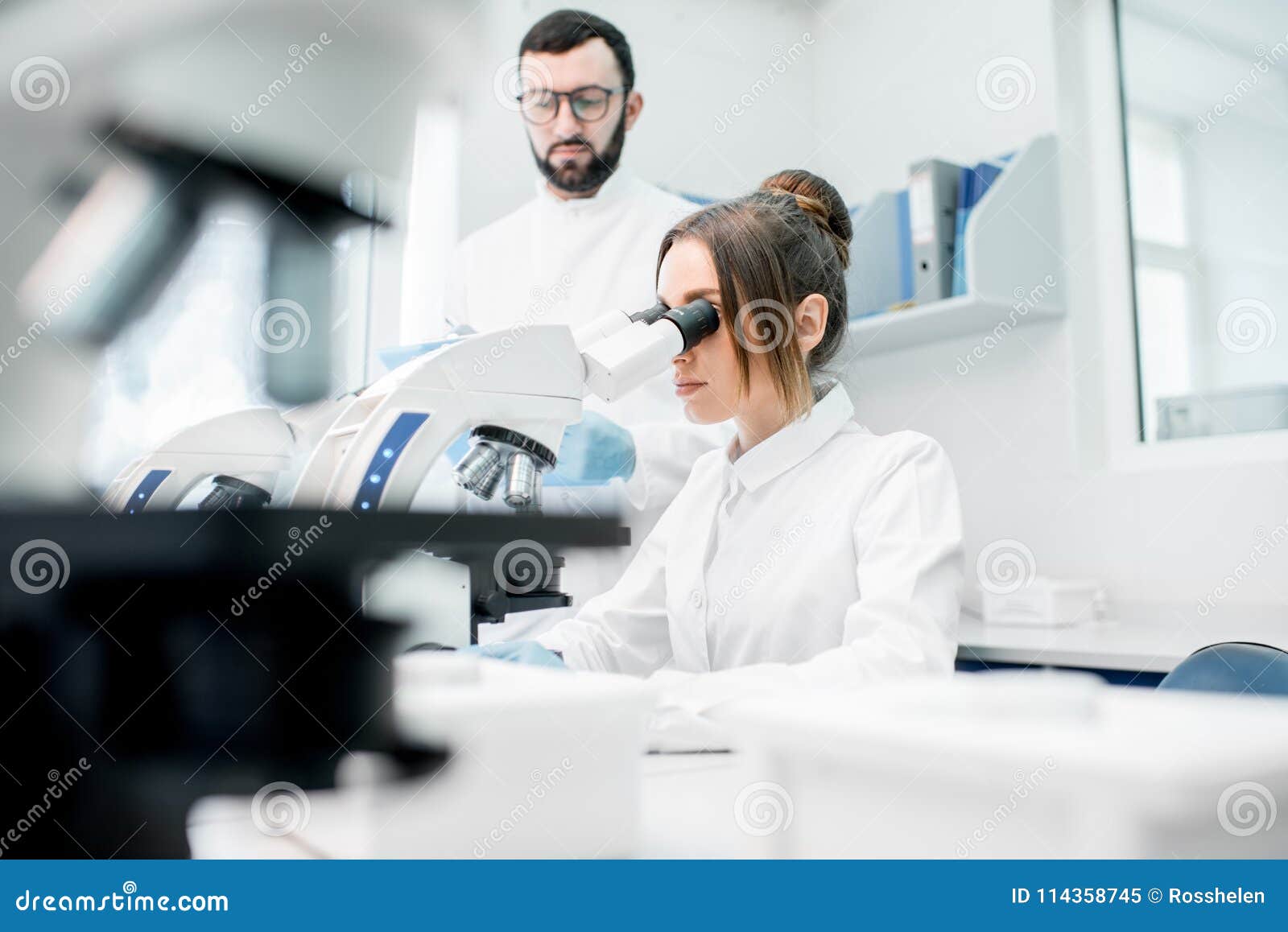 Medics Working with Microscope at the Laboratory Stock Image - Image of ...