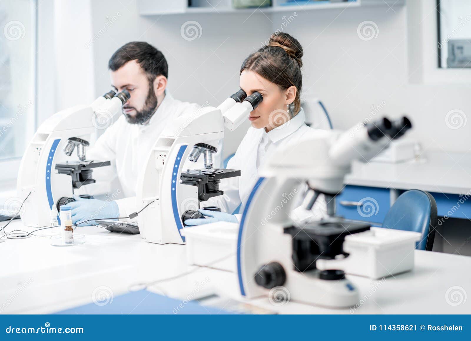 Medics Working with Microscope at the Laboratory Stock Image - Image of ...