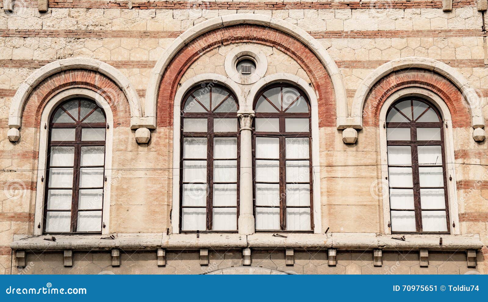 Medieval Arched Window Made Of Stained Glass. The Window Is Protected ...