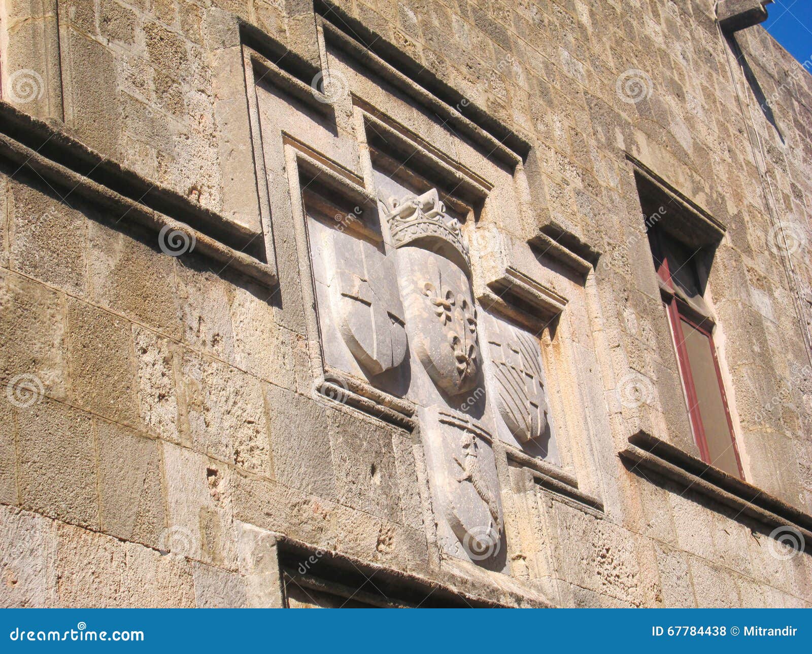 Family Crests On Stone Wall Stock Photo | CartoonDealer.com #93292464