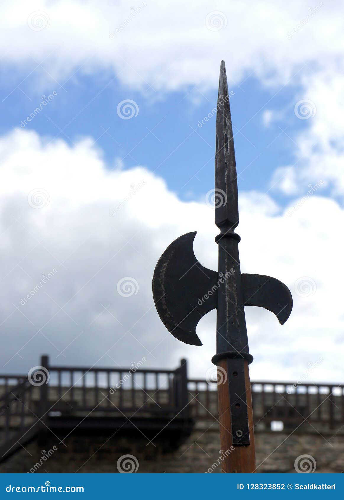 Medieval Halberdpike in Front of the Castle Wall and Cloudy Sky ...