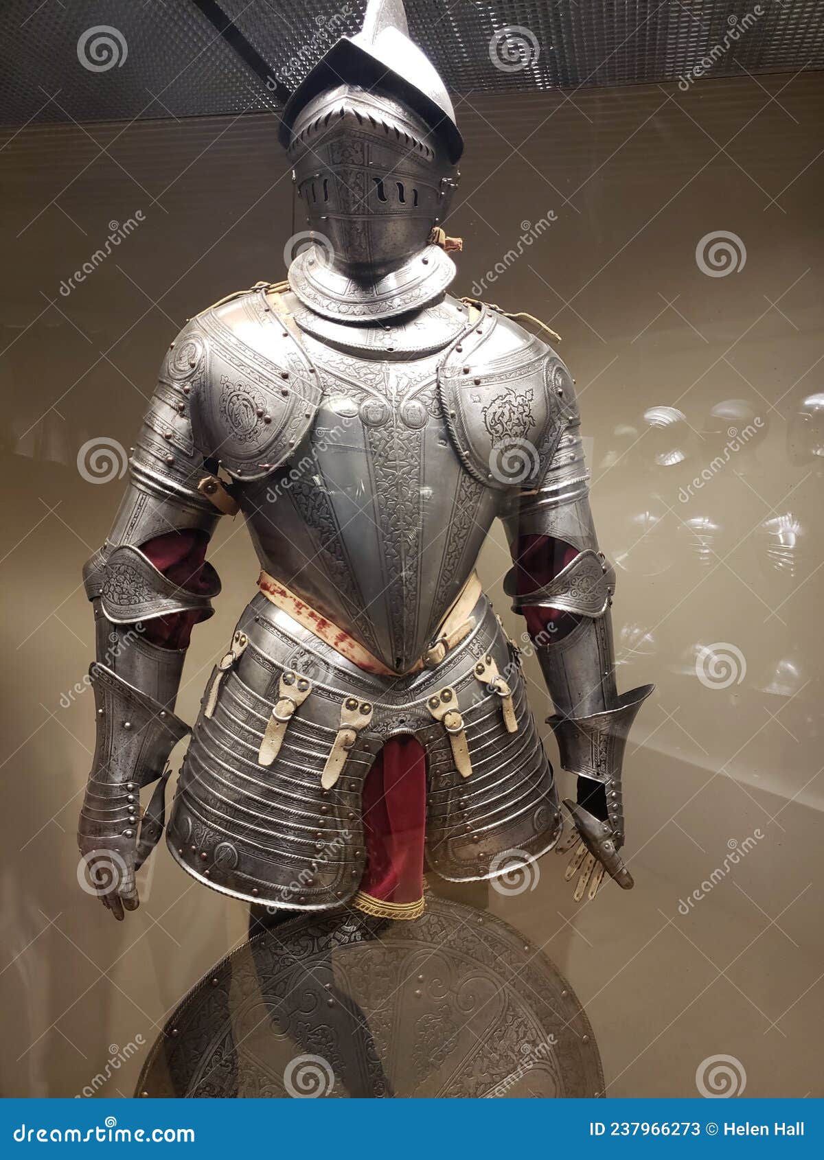 Knight In Armor With Shield And Sword Leaned Against The Wooden Railing ...