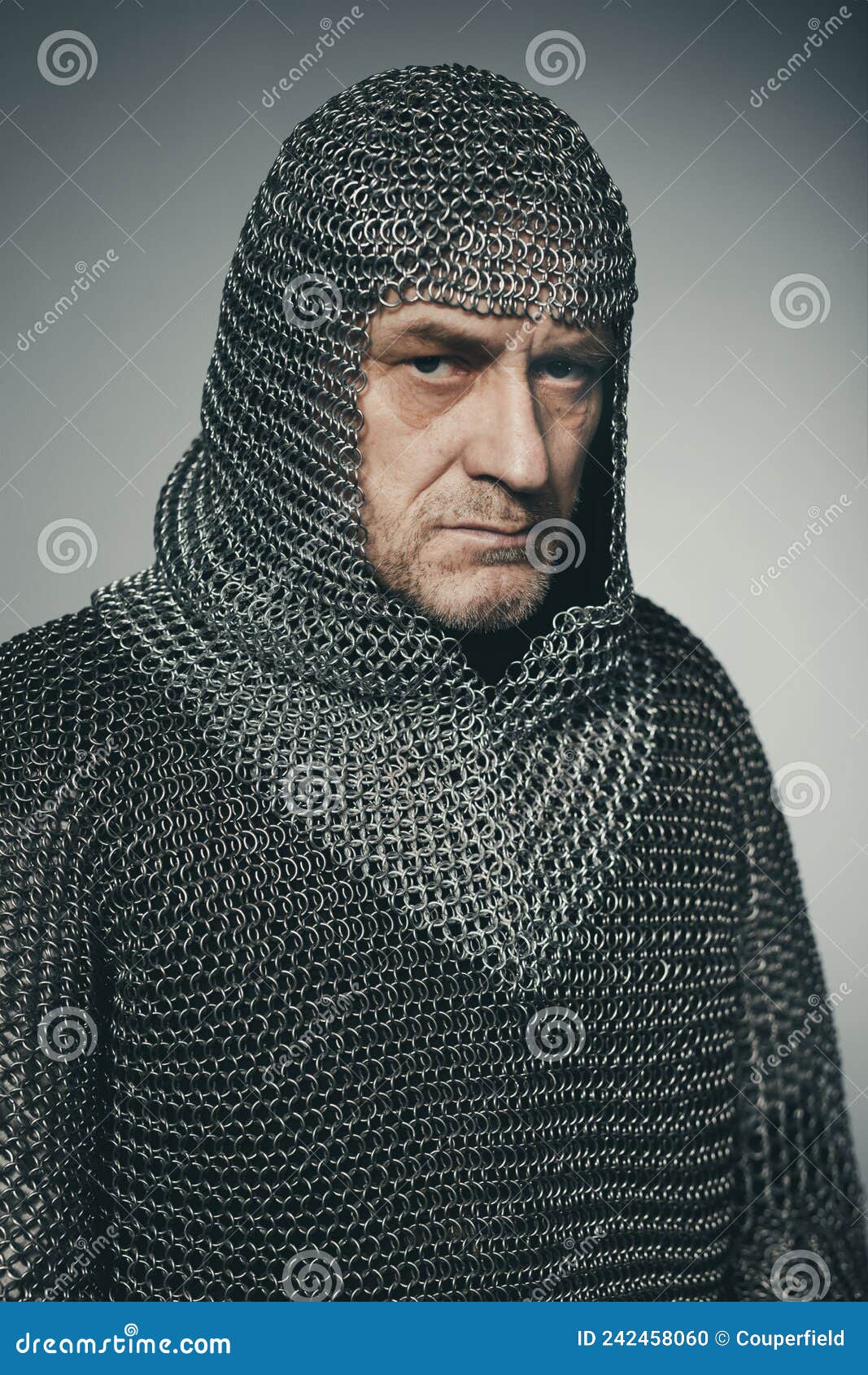Armed Man in Chain Armor with Sword Posing for Portrait in Studio Stock ...