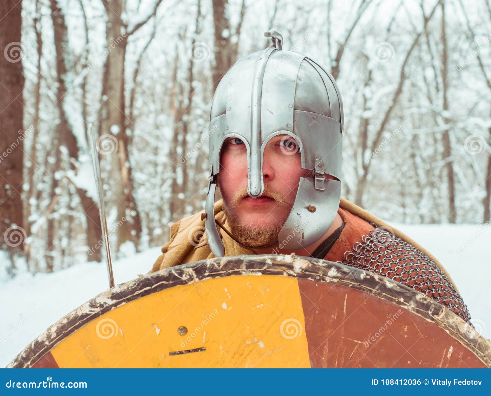 Medieval Irish Warrior in Chain Mail and Helmet Holds a Shield in the ...