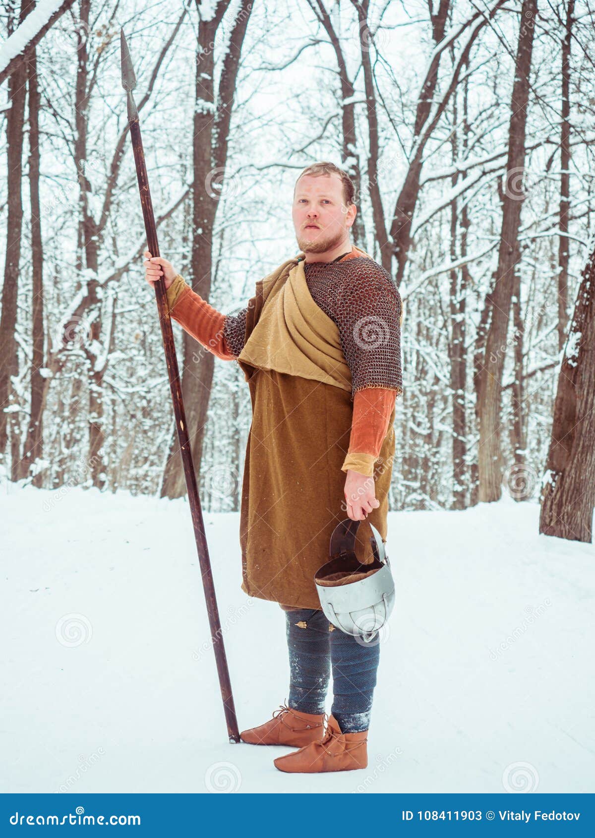 Medieval Irish Warrior in Chain Mail and Helmet Holds a Spear in the ...