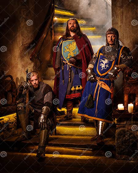 Medieval King with His Knights in Ancient Castle Interior. Stock Photo ...