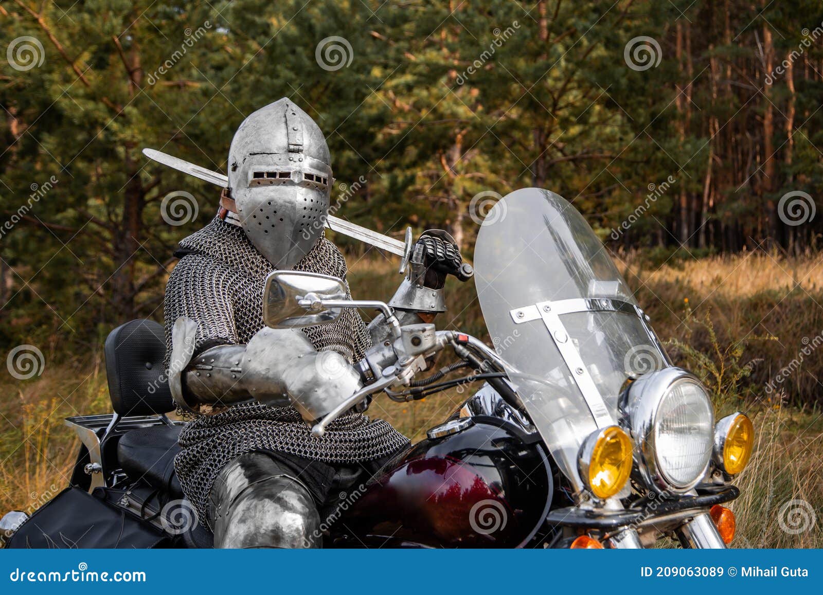 Medieval Knight in Chainmail and a Helmet with a Sword in His Hands ...
