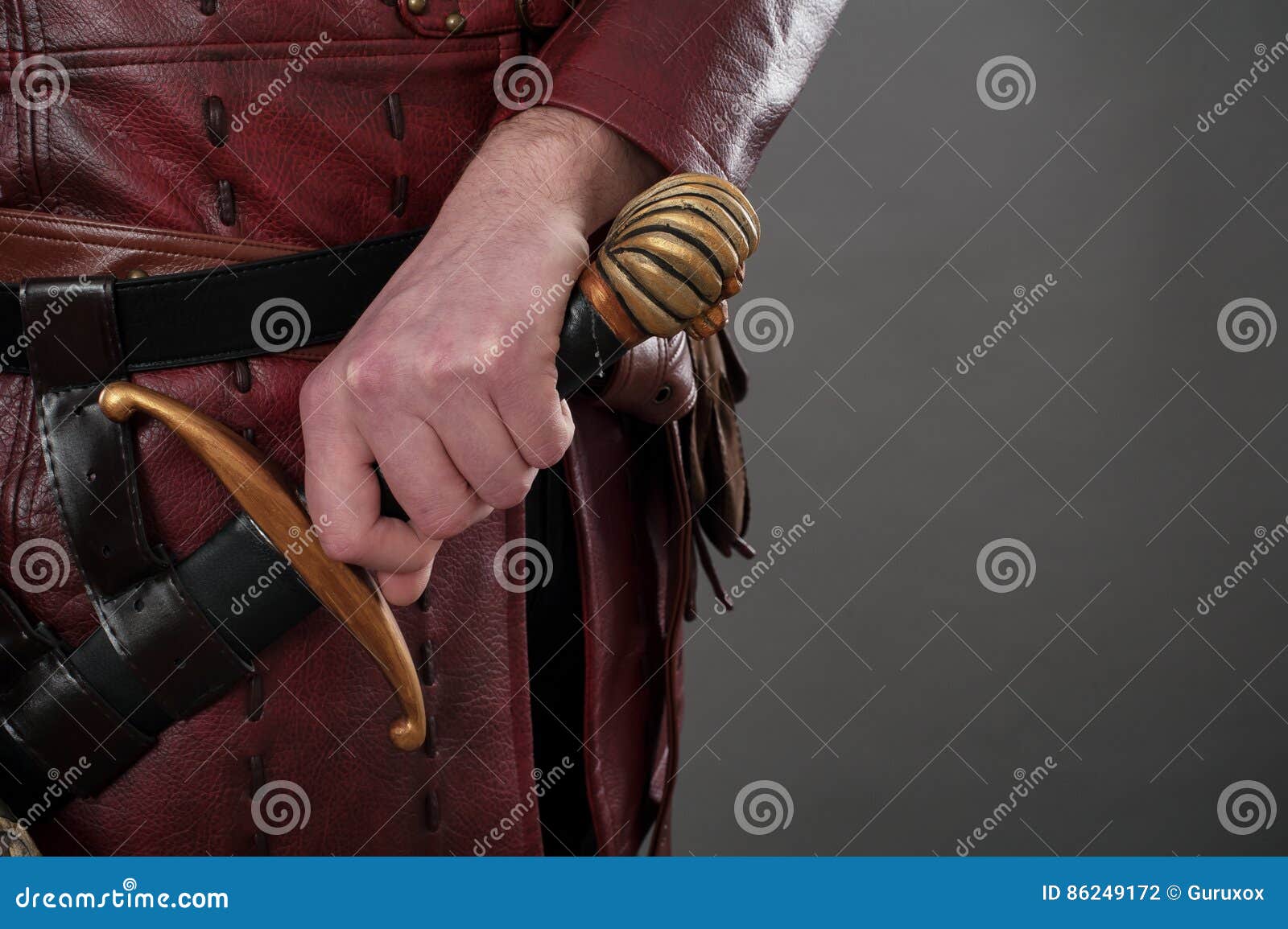 Medieval Knight Holding Hand on His Sword. Closeup Stock Photo - Image ...