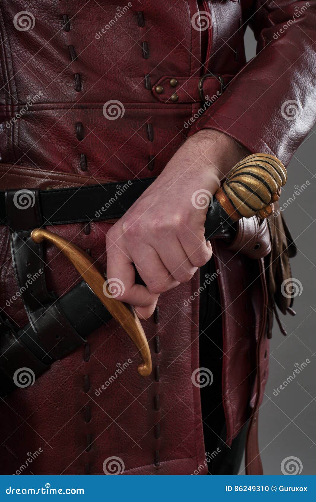 Medieval Knight Holding Hand on His Sword. Closeup Stock Photo - Image ...