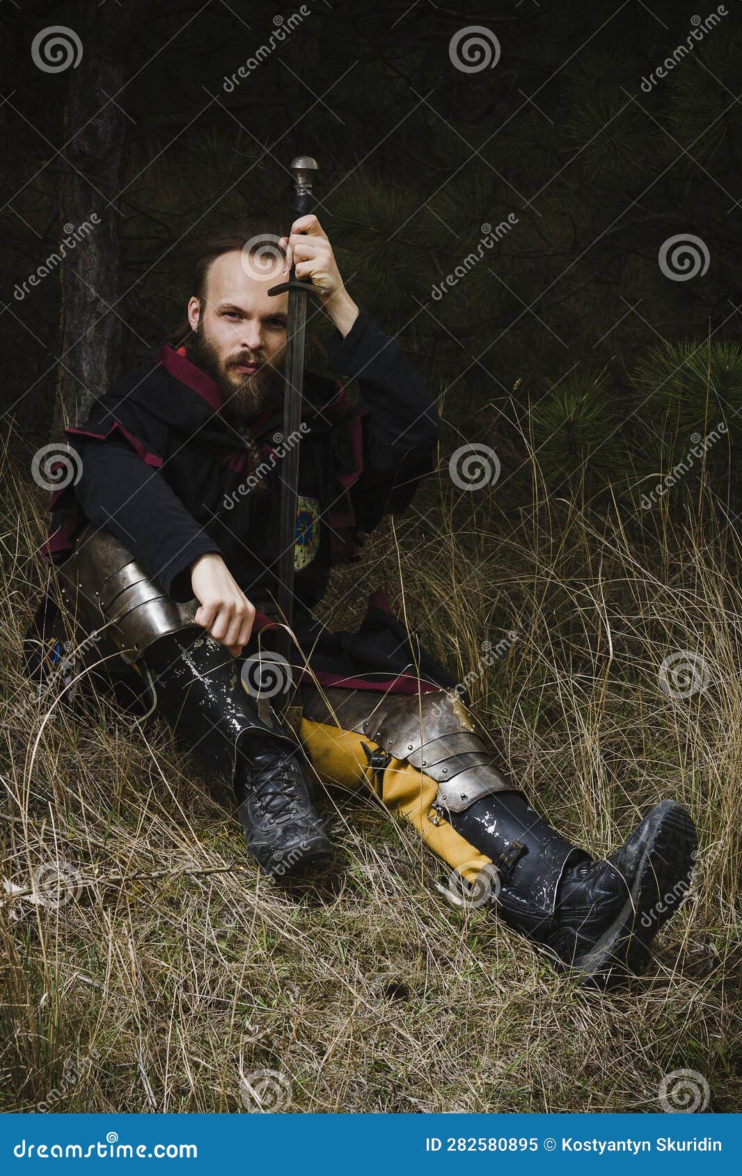 Medieval Knight Sits Leaning on a Sword Stock Image - Image of knight ...