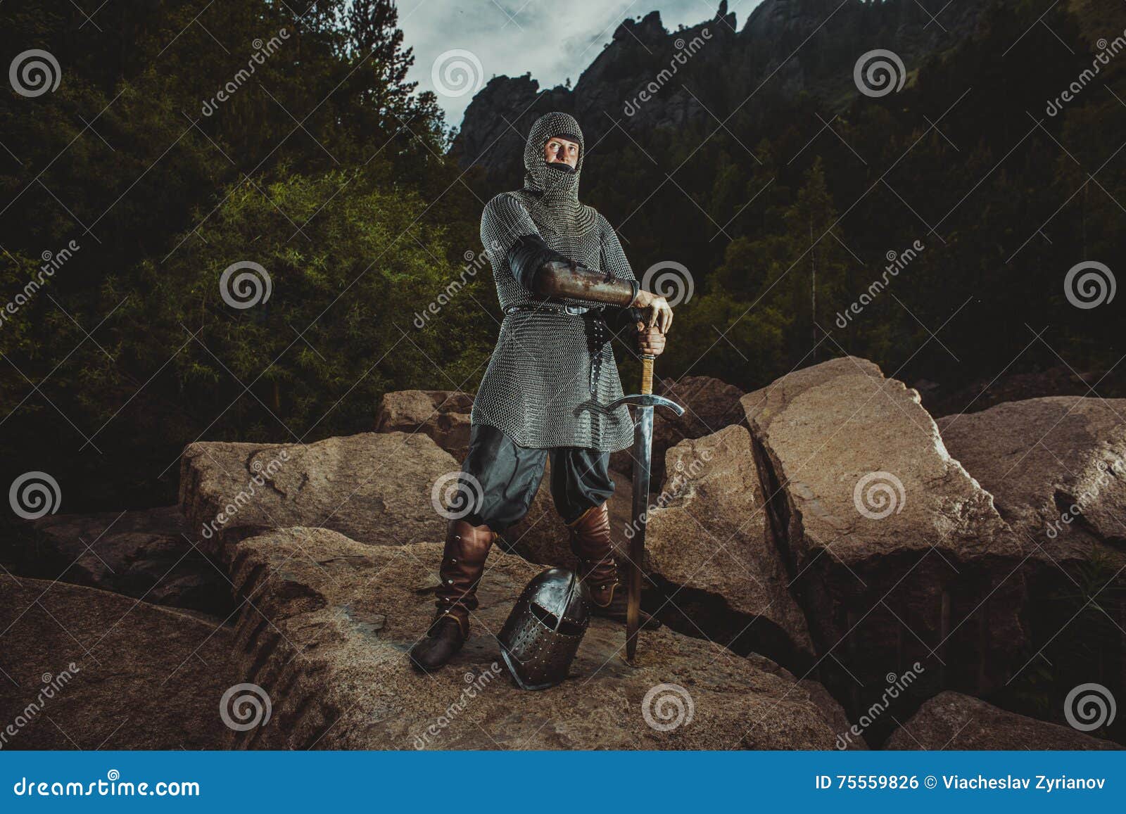 Medieval Knight Stands On Rocks Holding A Sword Stock Photography ...