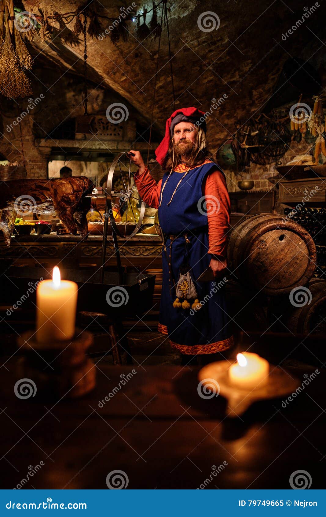 Medieval Man Doing Roasted Pig on the Rack in Ancient Castle Kitchen ...