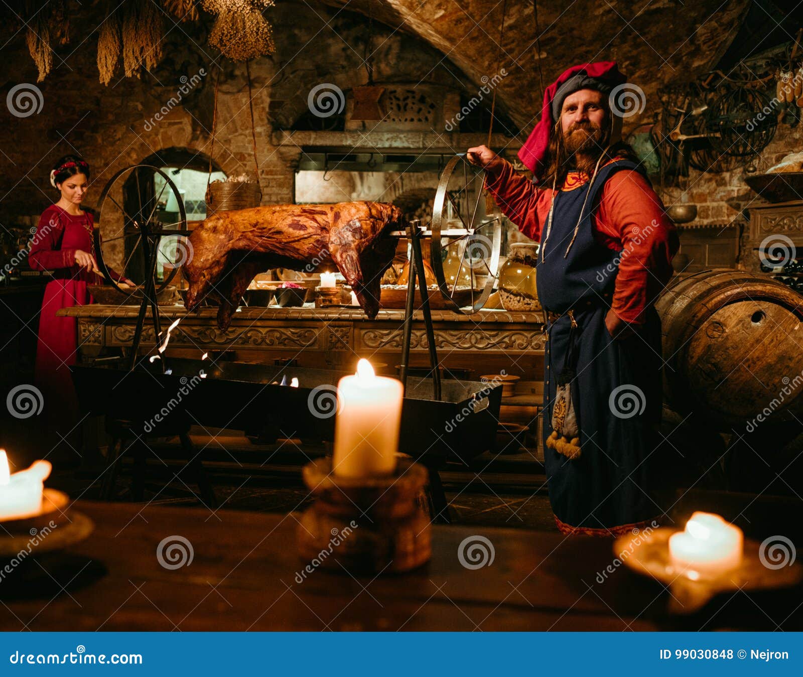 Medieval Man Doing Roasted Pig on the Rack Stock Photo - Image of ...