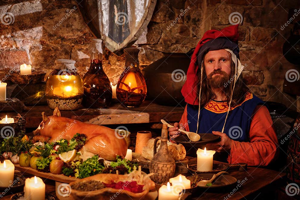 Medieval Man Eat and Drink in Ancient Castle Kitchen Interior. Stock ...