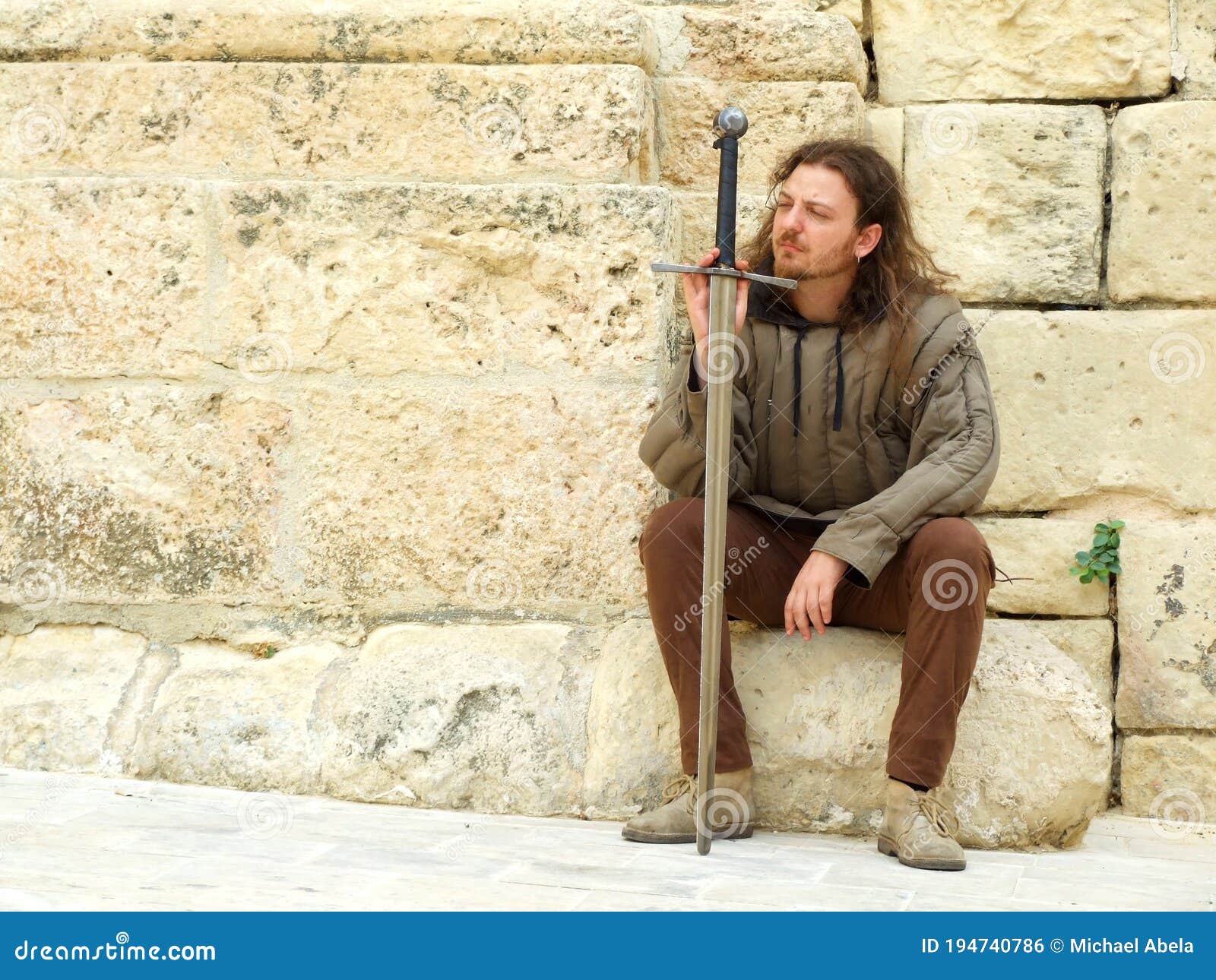 A Medieval Peasant Resting editorial photo. Image of sitting - 194740786