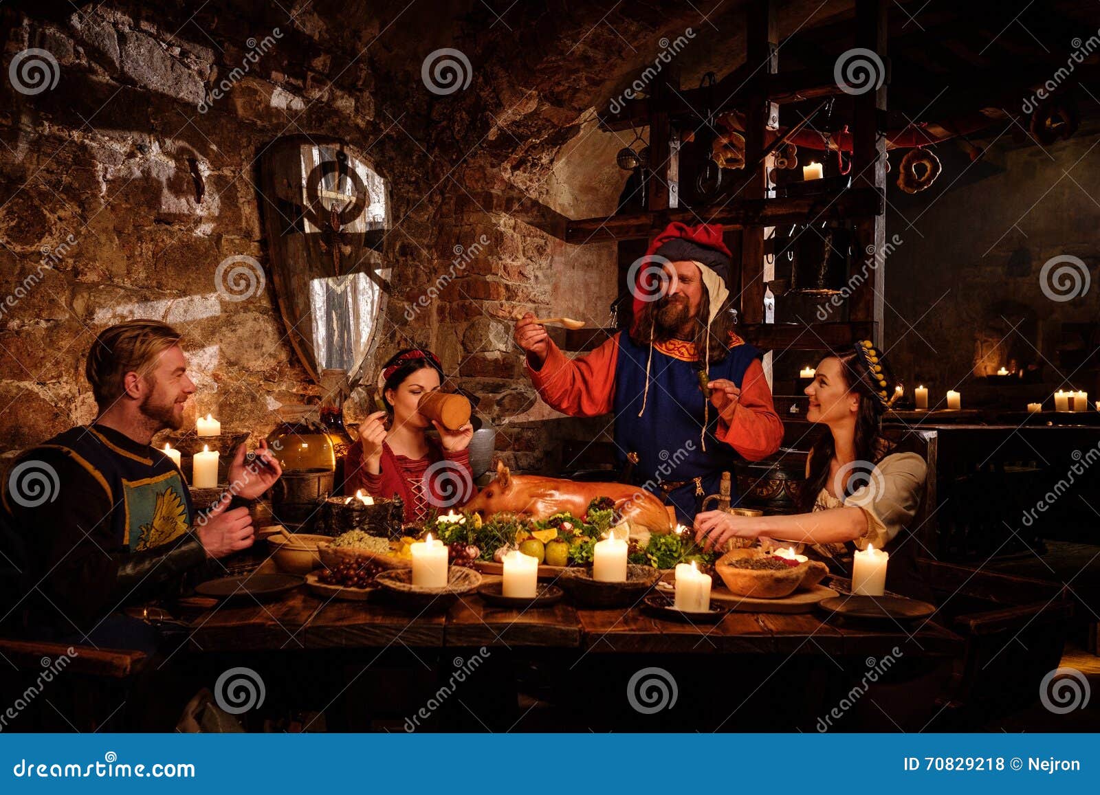 Medieval People Eat and Drink in Ancient Castle Kitchen Interior. Stock ...