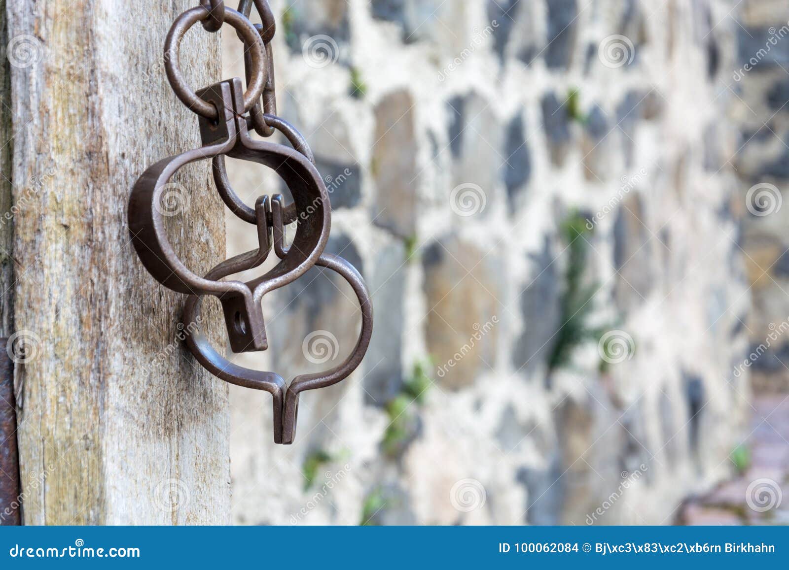 Medieval Prison Chains for Prisoners in Front of Stone Wall Stock Photo ...