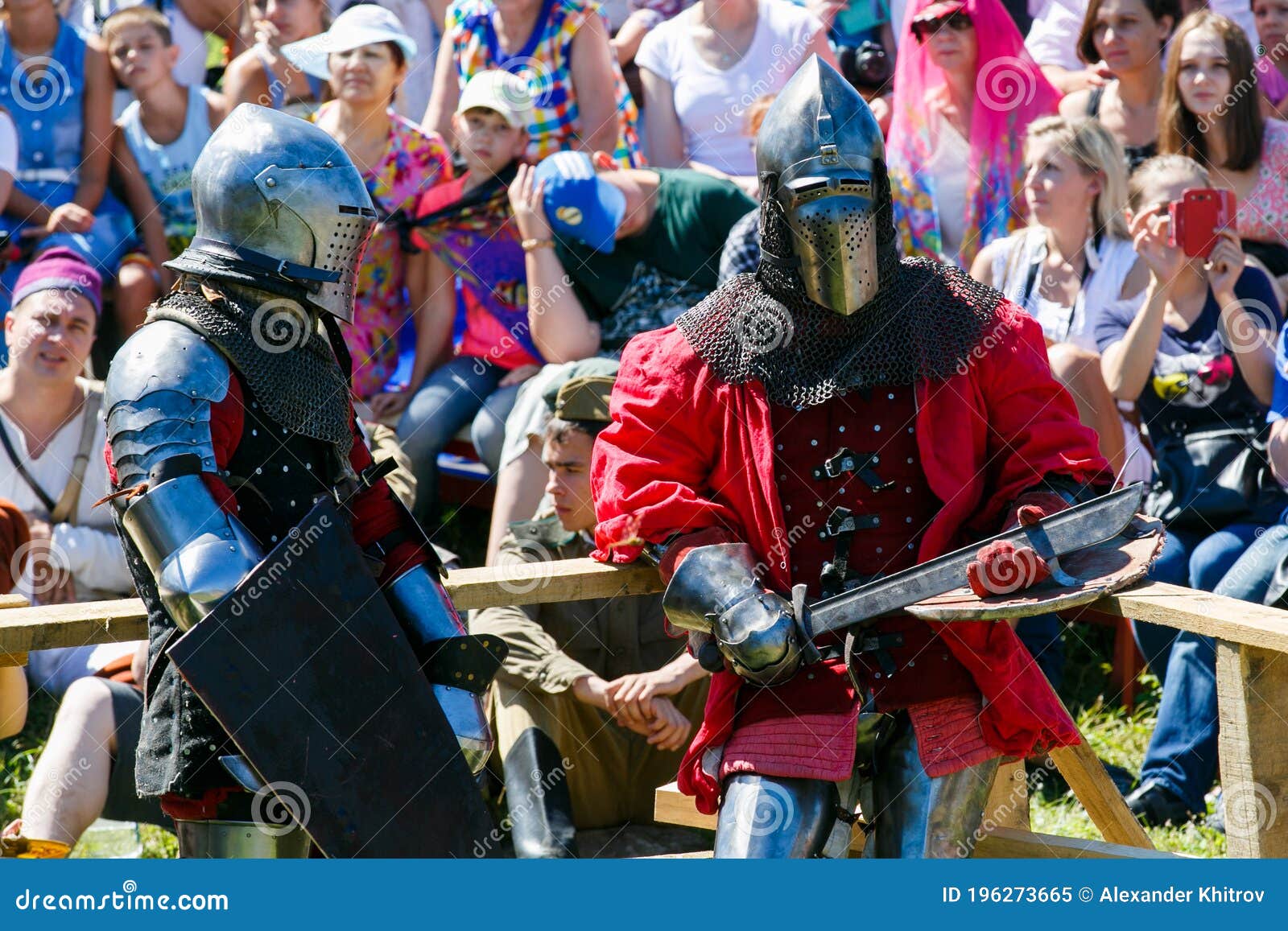 Medieval Restorers Fight with Swords in Armor at a Knightly Tournament ...