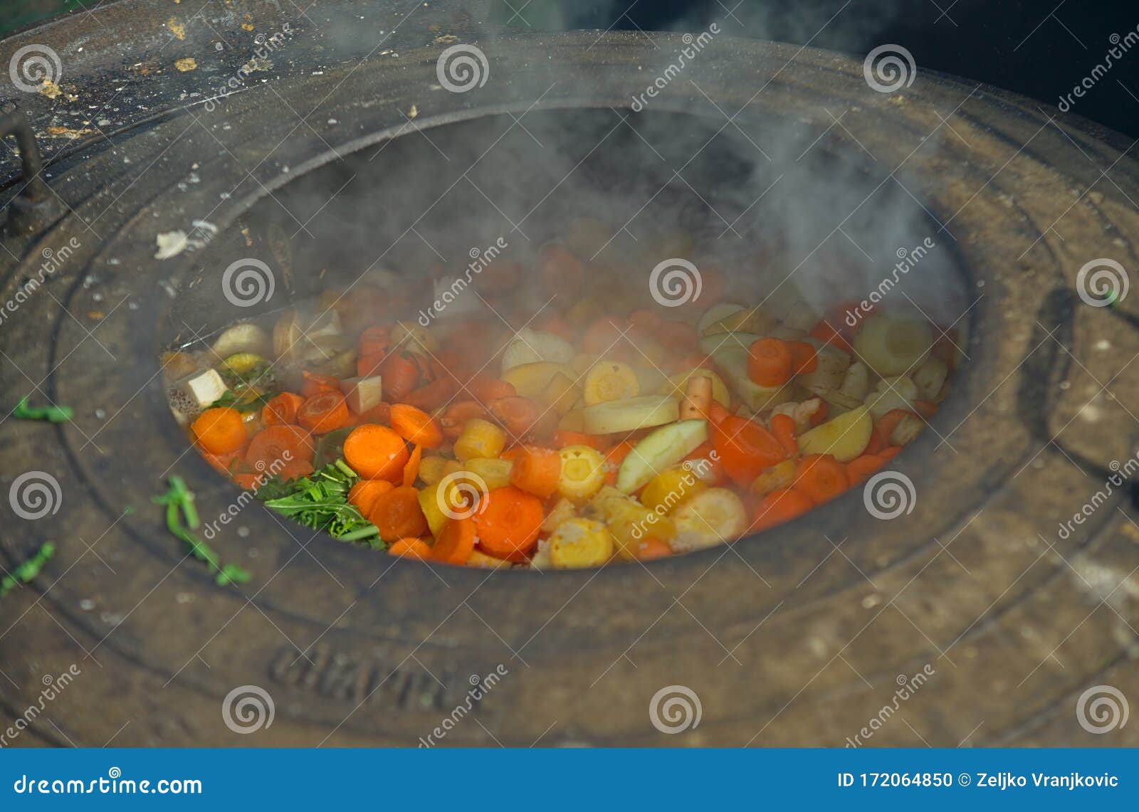 Medieval Style Cooking of Various Vegetables in Big Metal Pot Stock ...