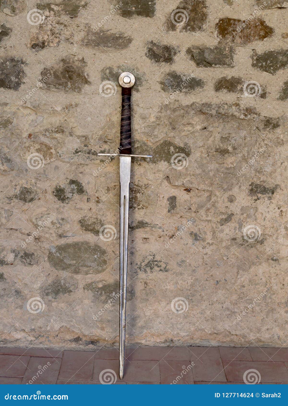 Medieval Sword Leaning on Stone Wall. Stock Photo - Image of weapon ...