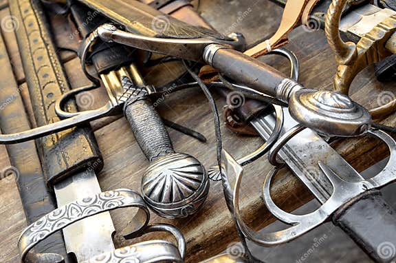 Medieval Swords on a Wood Table Stock Image - Image of historic, sharp ...