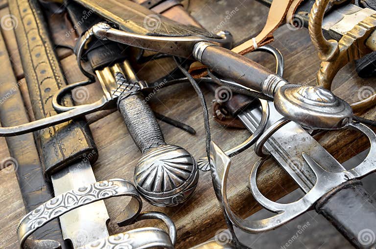 Medieval Swords on a Wood Table Stock Image - Image of historic, sharp ...