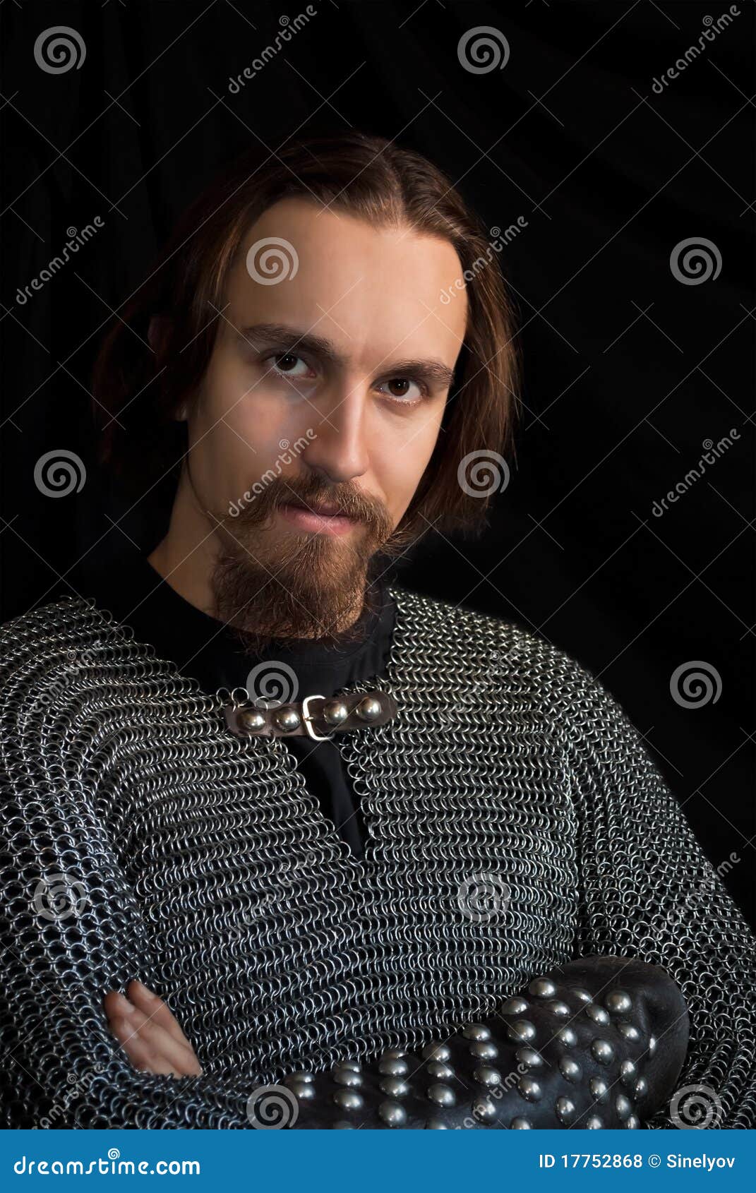 Medieval Warrior In Armor, Helmet, Black Cloak With A Saber In His ...